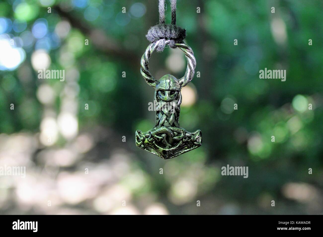 Scandinavian amulet in the form of the Thor's hammer - "Mjölnir". Color ...