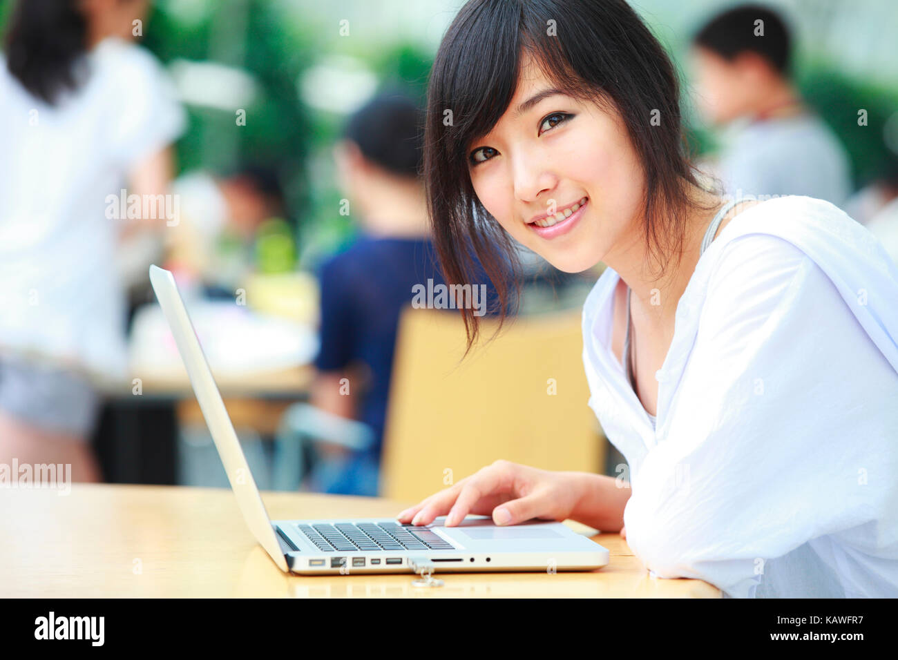 one young Chinese college student study in the college library looking ...