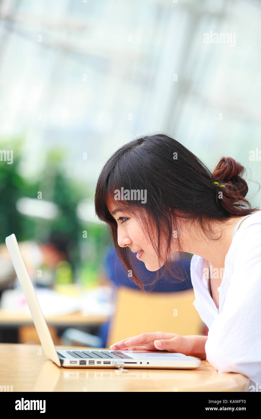 one young Chinese college student study in the college library Stock ...