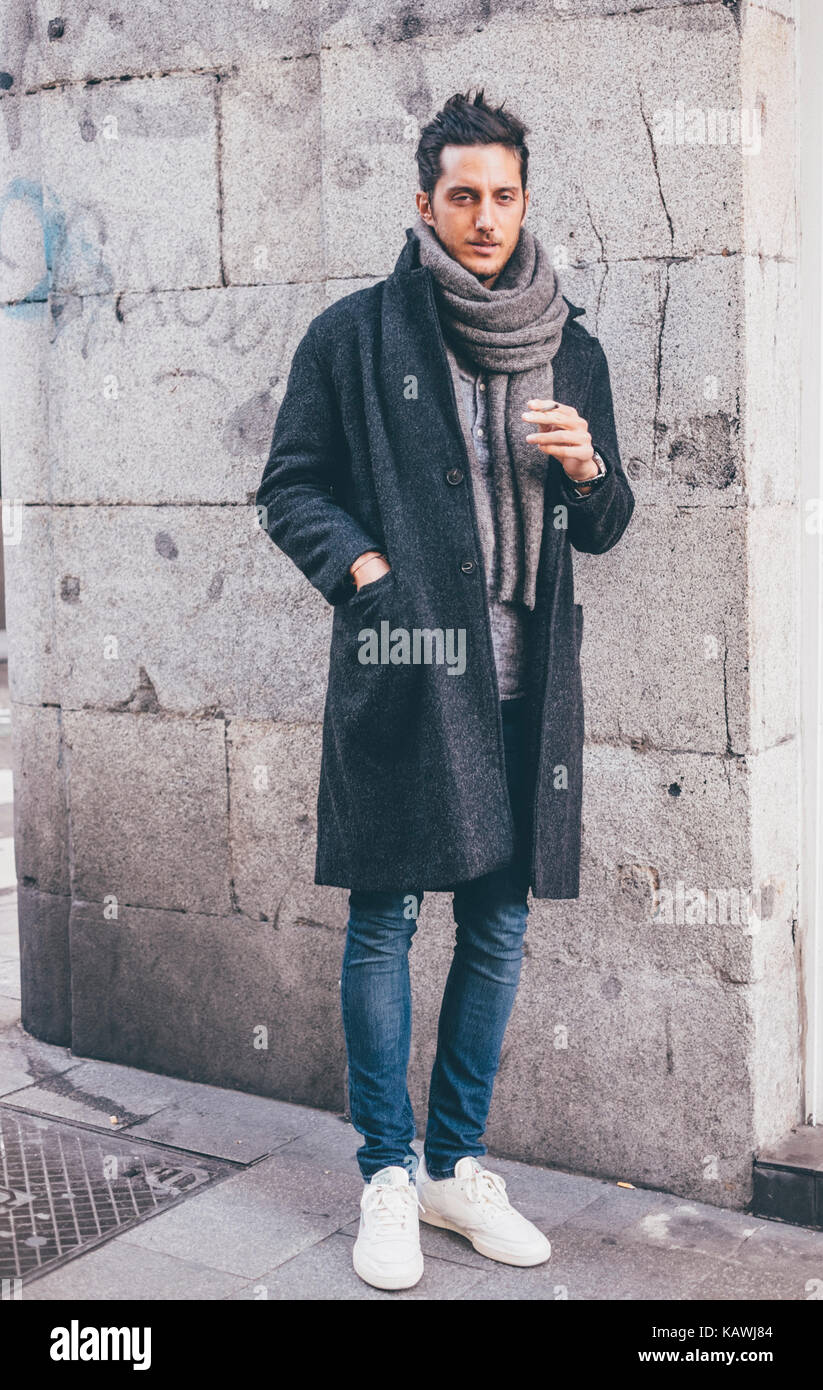 Young man smoking // Street style in Madrid Stock Photo - Alamy