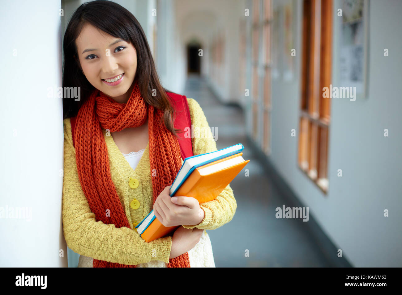 one pretty Chinese asian college student smile at camera in campus ...