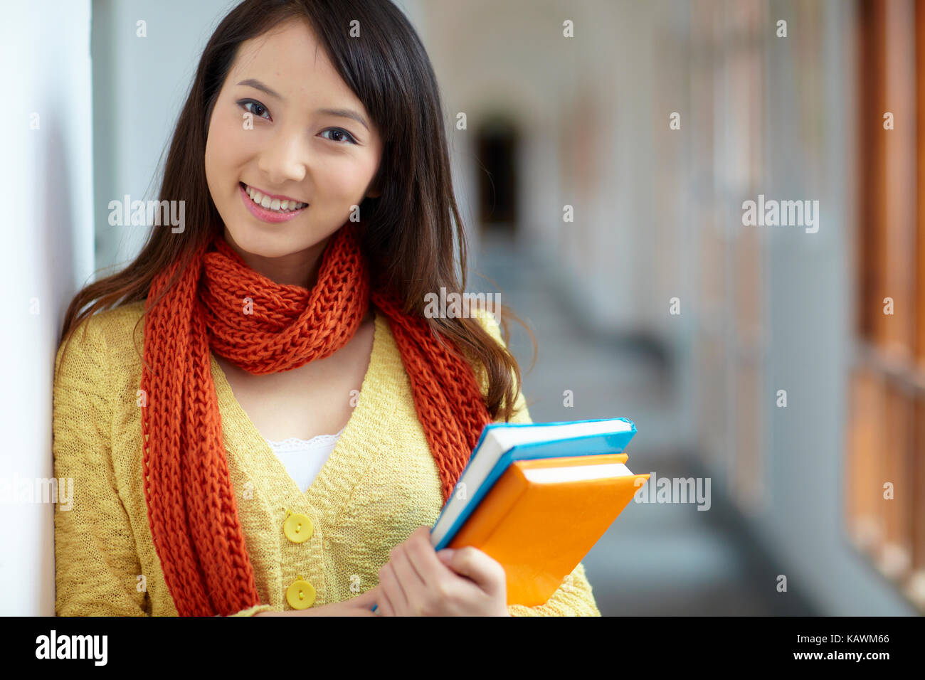 one pretty Chinese asian college student smile at camera in campus ...