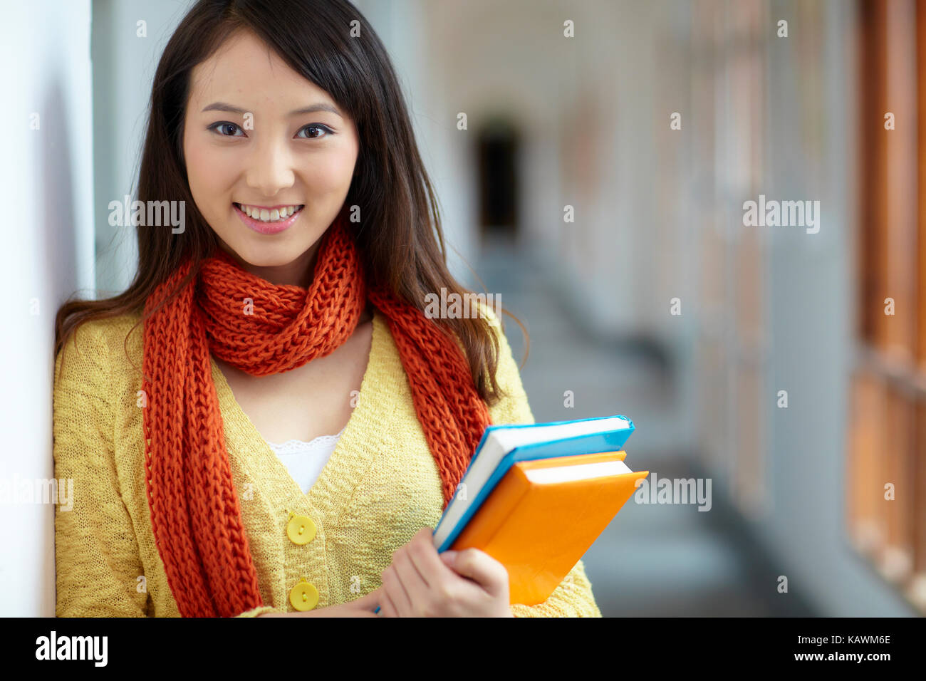 one pretty Chinese asian college student smile at camera in campus ...