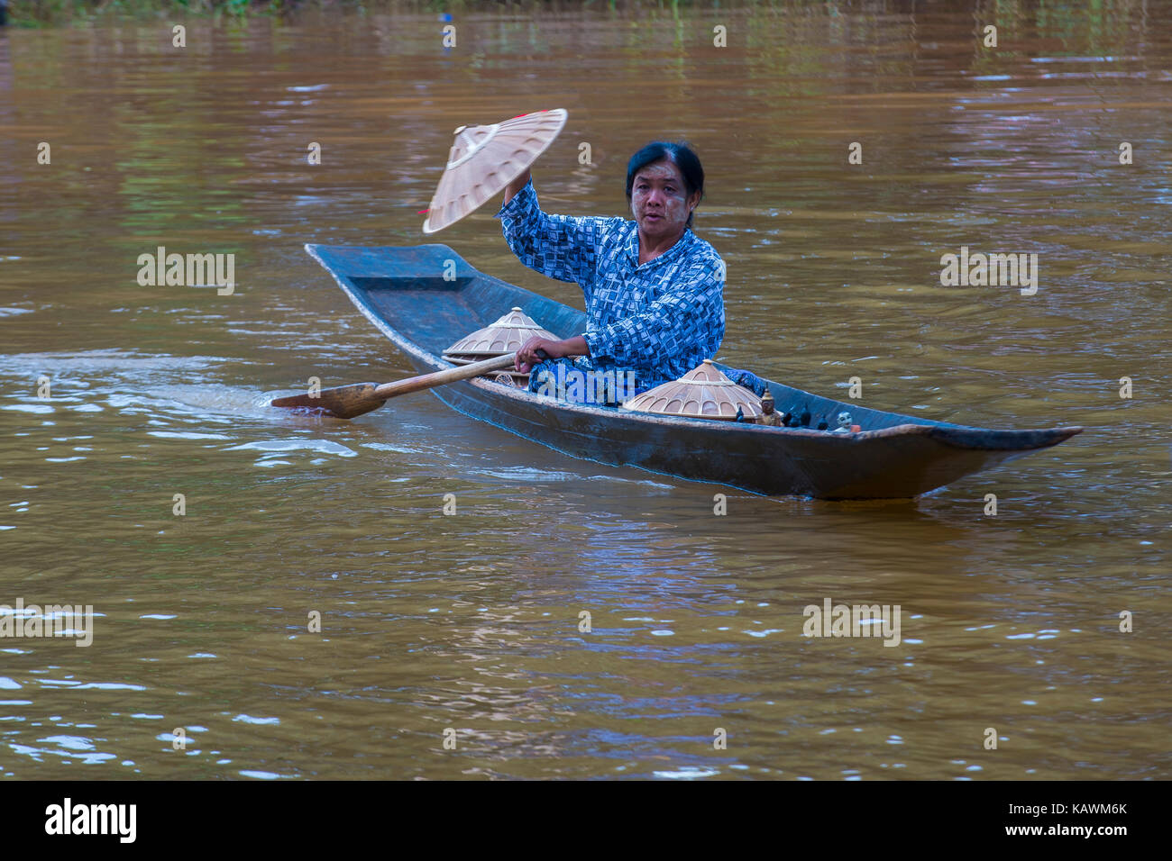 Intha woman on her boat in Inle lake Myanmar Stock Photo - Alamy