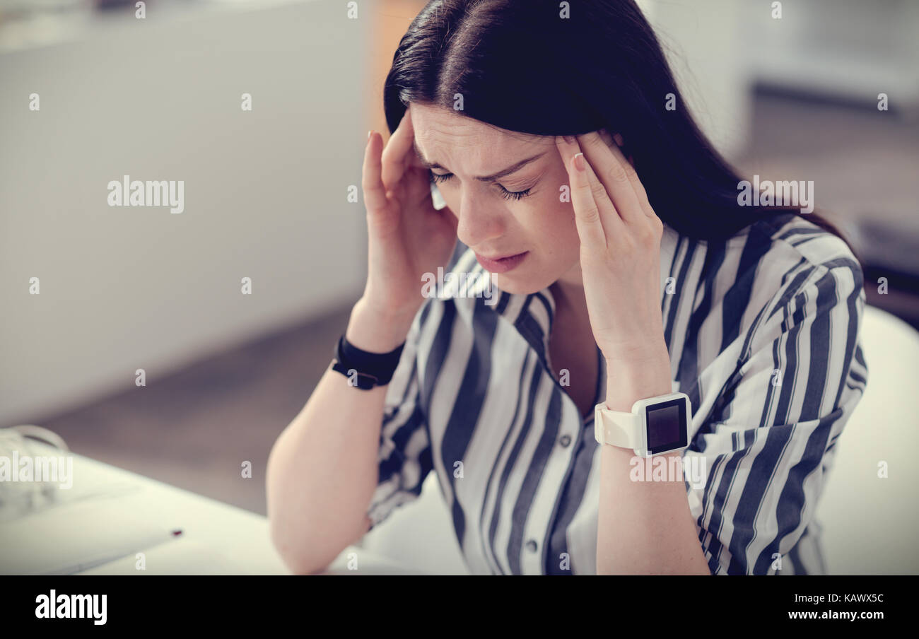 Nice beautiful woman suffering from migraine Stock Photo - Alamy