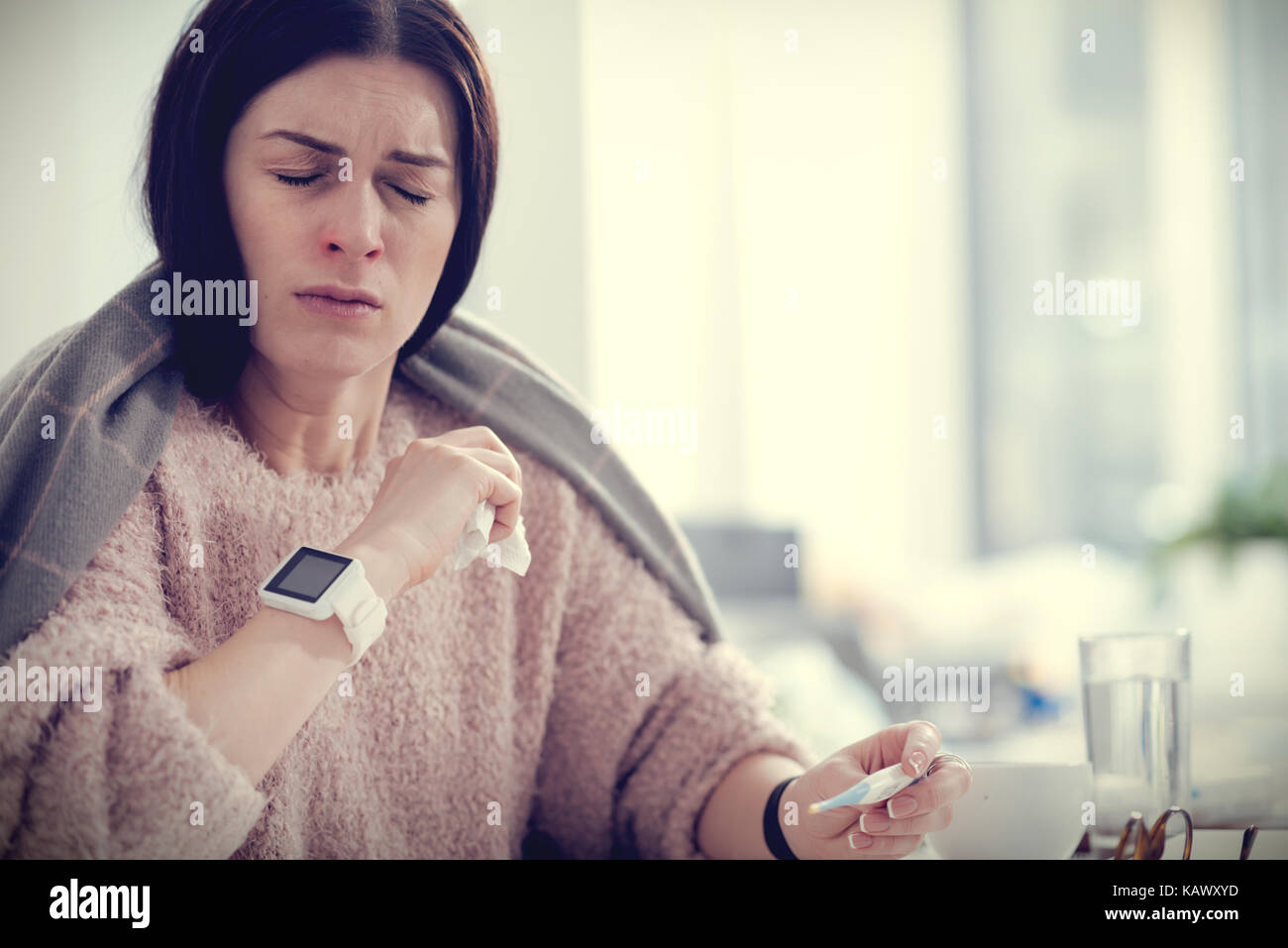 Unhappy ill woman having high body temperature Stock Photo - Alamy