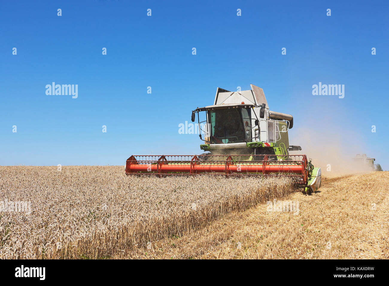 A modern combine harvester working a wheat field Stock Photo - Alamy