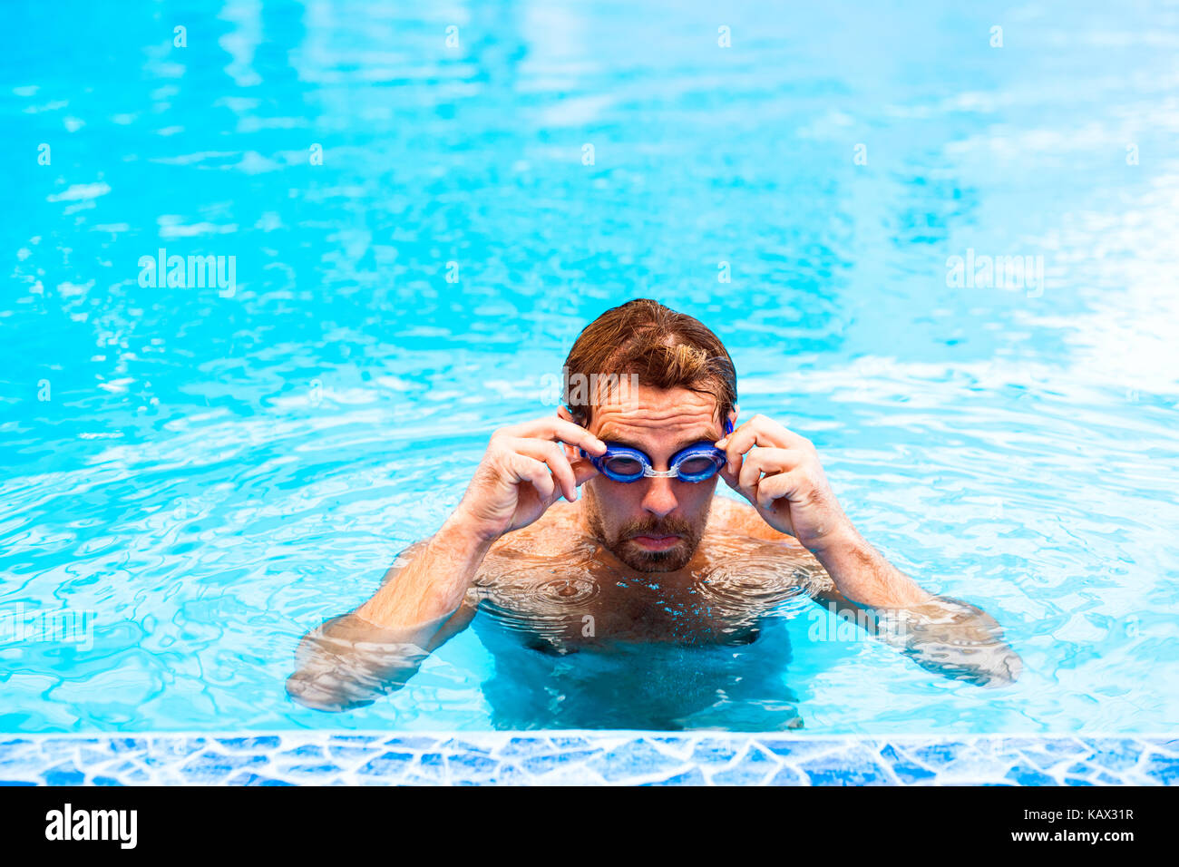 Action man in swimming pool hi-res stock photography and images - Alamy