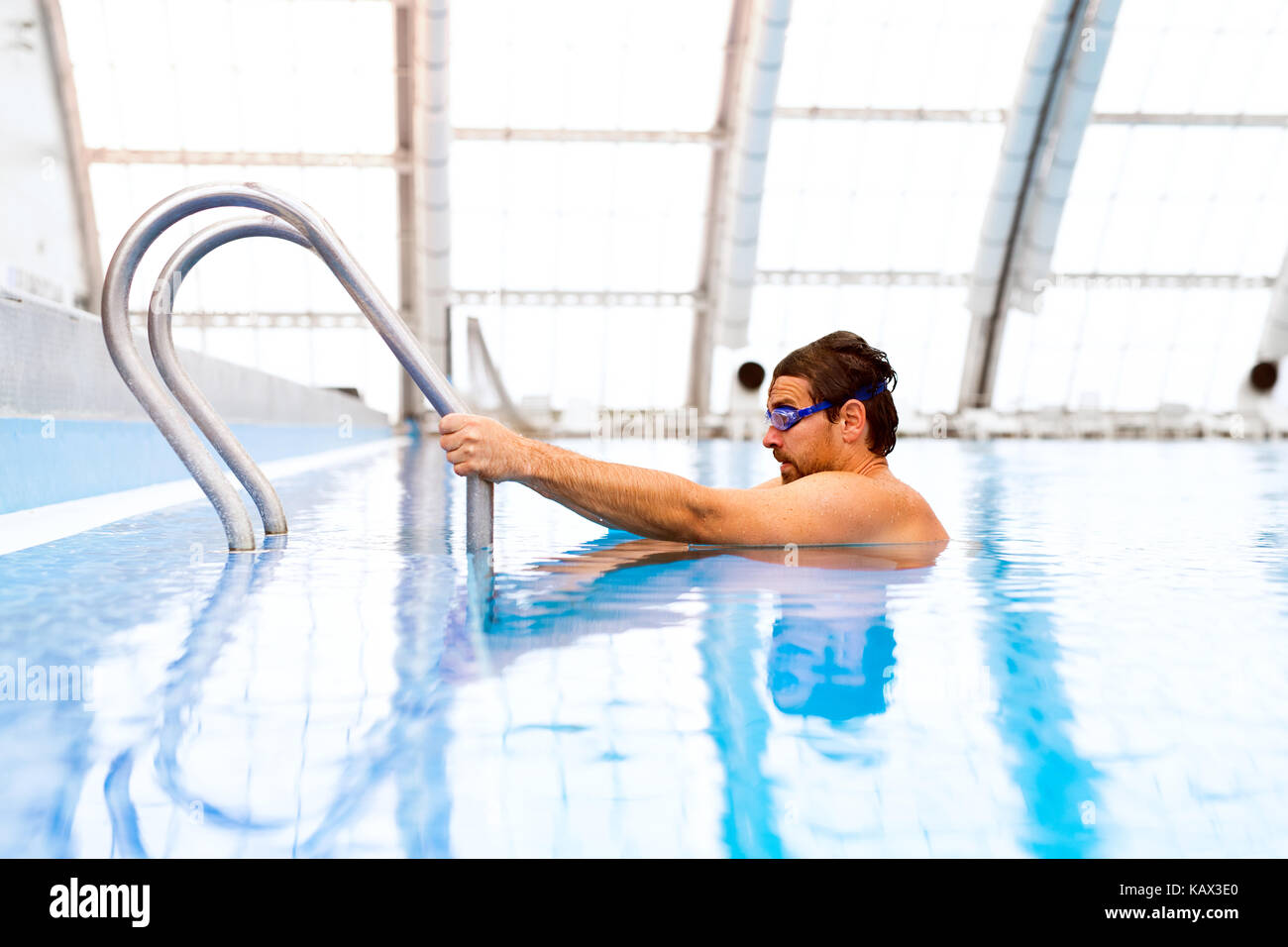 Man swimming in an indoor swimming pool Stock Photo - Alamy