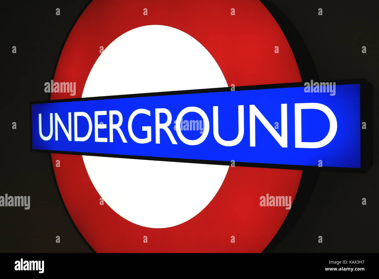Illuminated Decorative Underground Sign on Black Background Stock Photo ...