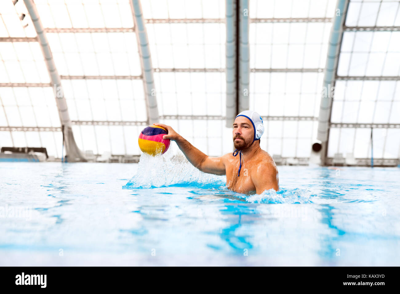 Water polo player in a swimming pool Stock Photo - Alamy