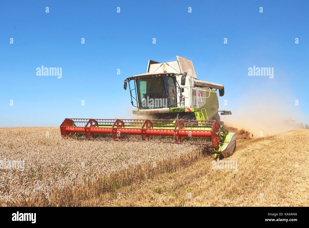 A modern combine harvester working a wheat field Stock Photo - Alamy