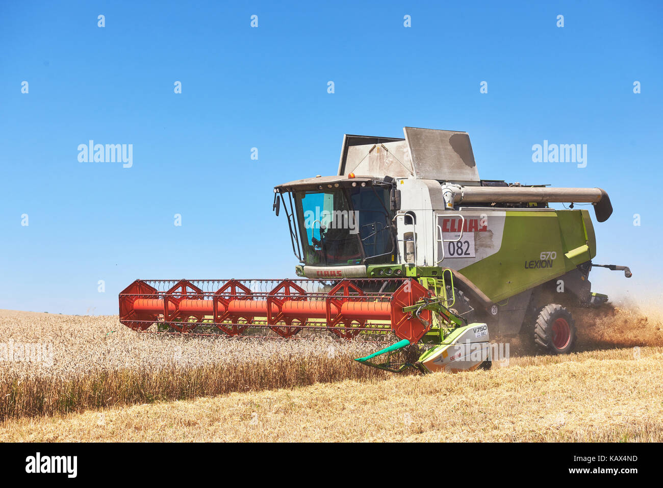 A modern combine harvester working a wheat field Stock Photo - Alamy