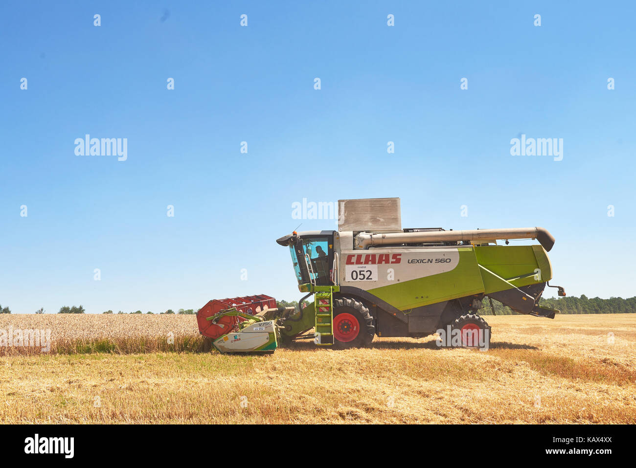 A modern combine harvester working a wheat field Stock Photo - Alamy
