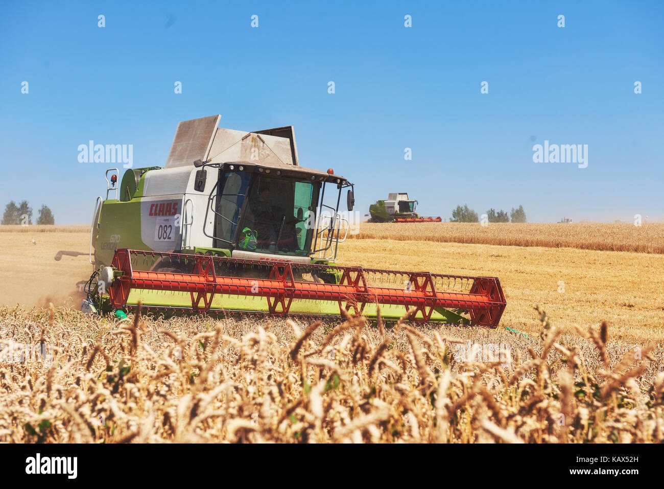 A modern combine harvester working a wheat field Stock Photo - Alamy