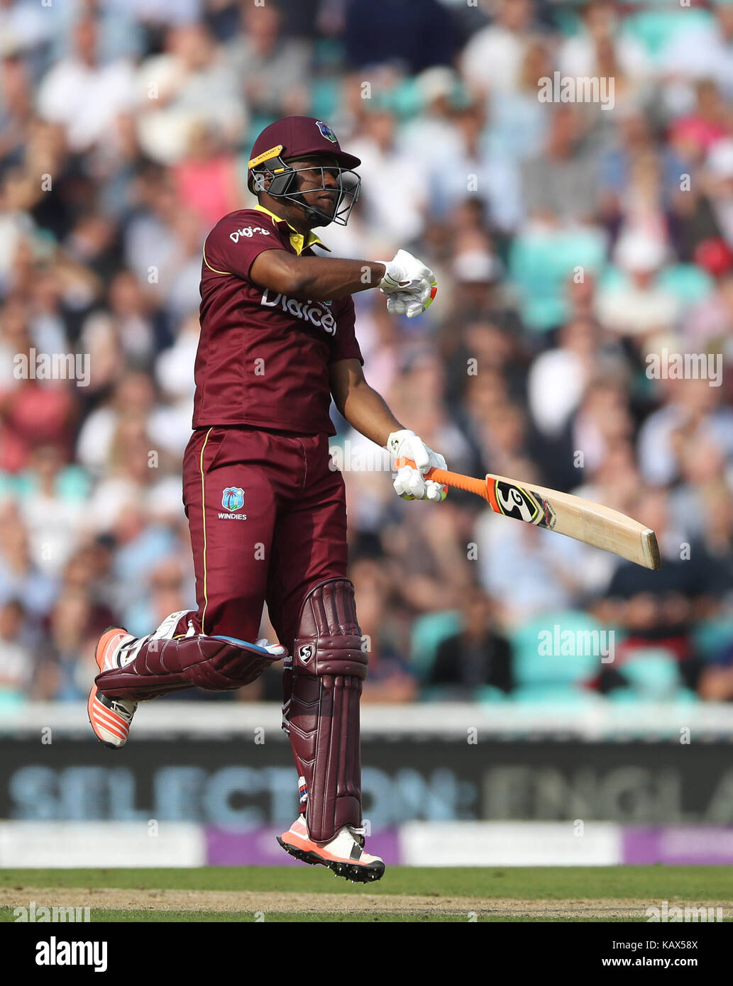 West Indies' Evin Lewis celebrates his century during the Fourth Royal ...
