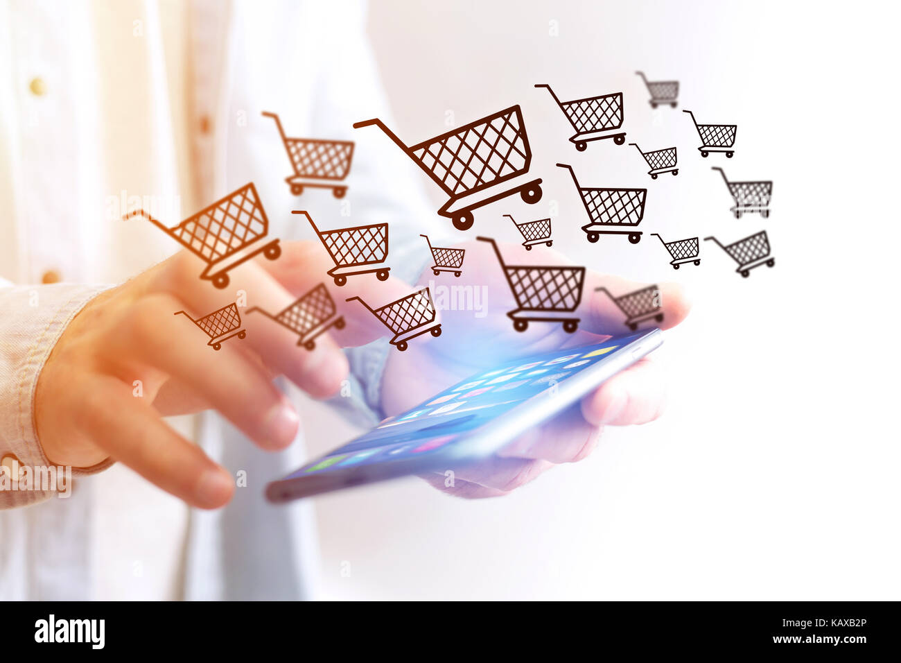 View of a Virtual trolley going out of a smartphone - shopping online ...