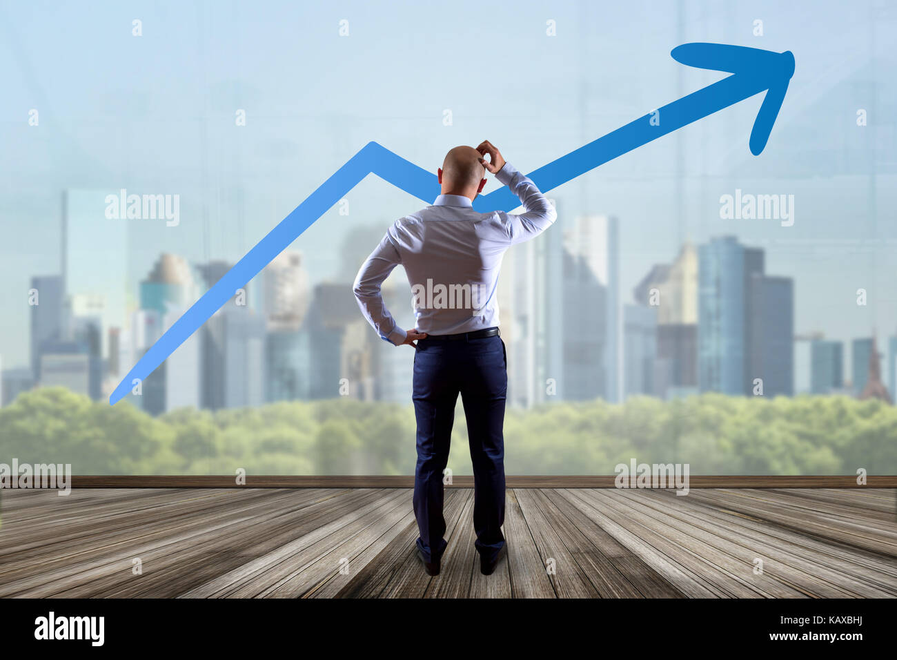 View of a Businessman in front of a wall thinking about possibilities ...