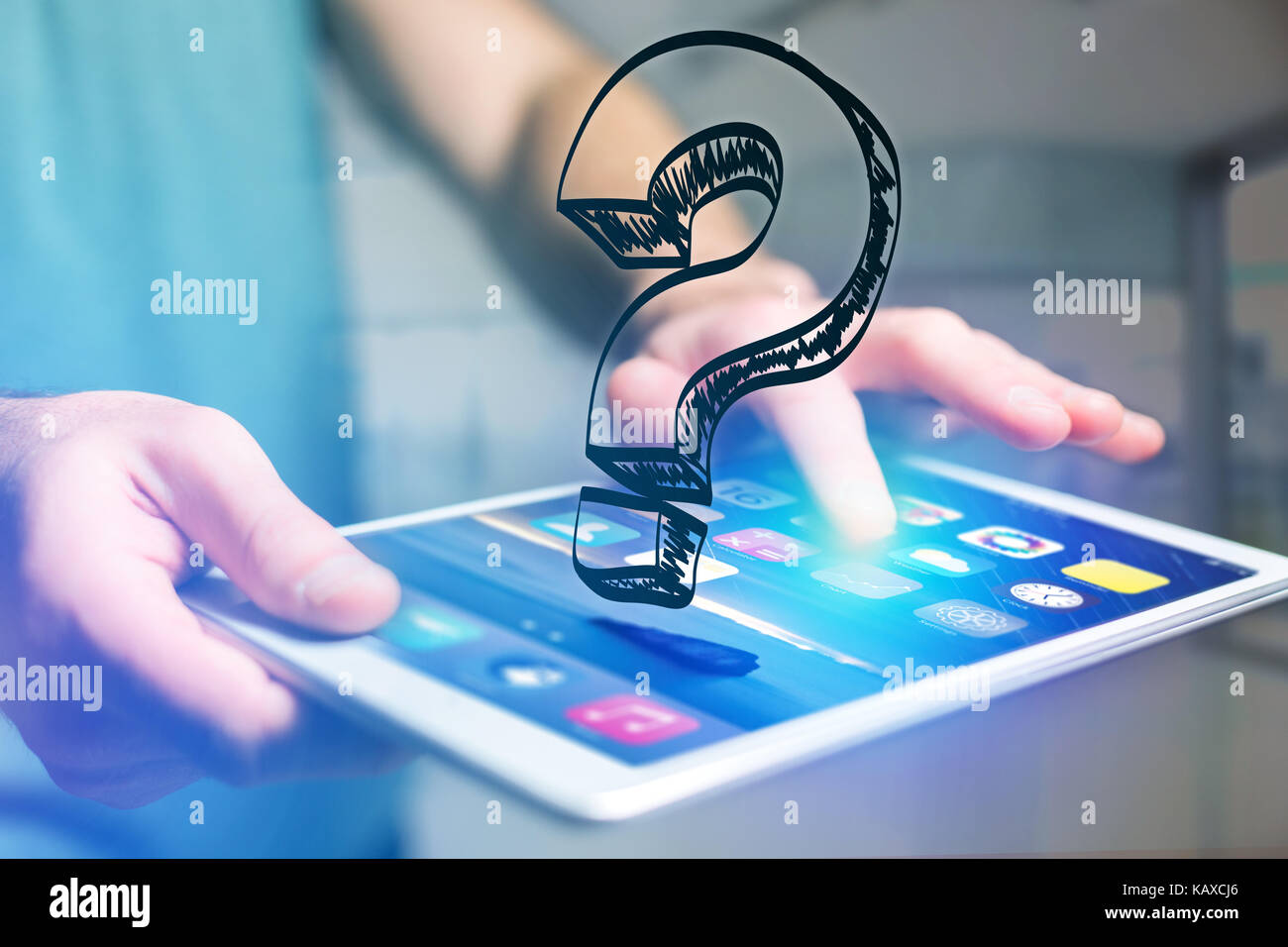 View of Hand drawn question mark icon going out a tablet interface of a ...