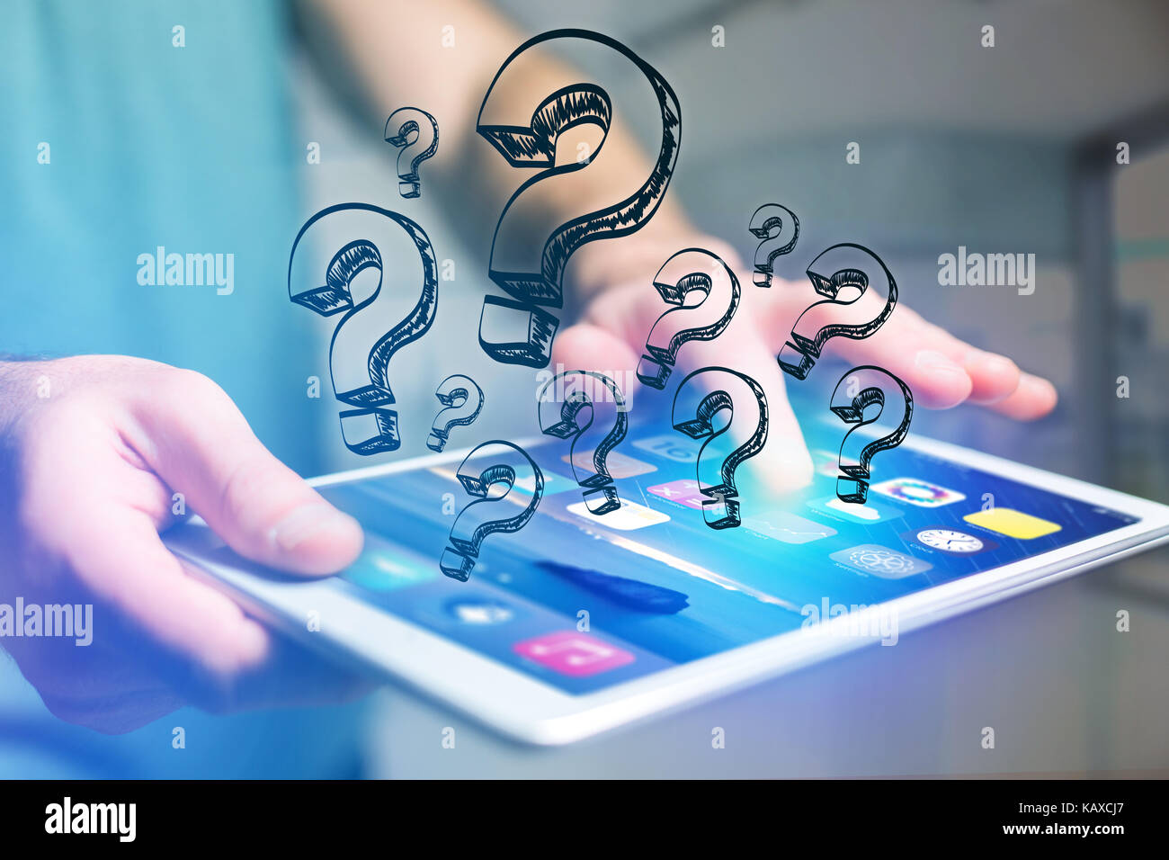 View of Hand drawn question mark icon going out a tablet interface of a ...