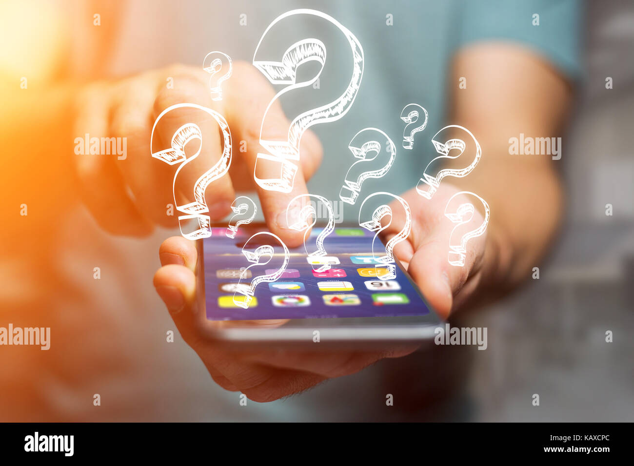 View of Hand drawn question mark icon going out a smartphone interface ...