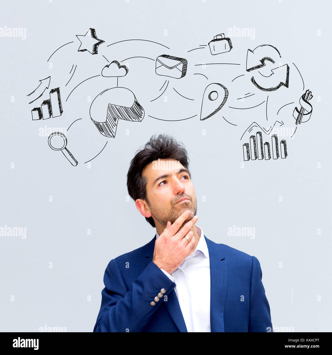 Portrait view of an attractive dubious business man with business icons ...