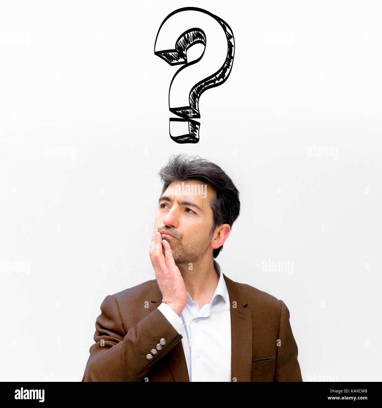 Portrait view of an attractive stressed business man with question mark ...