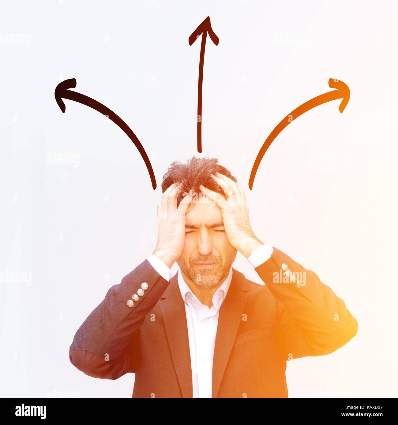 Portrait view of an attractive business man with arrows over his head ...