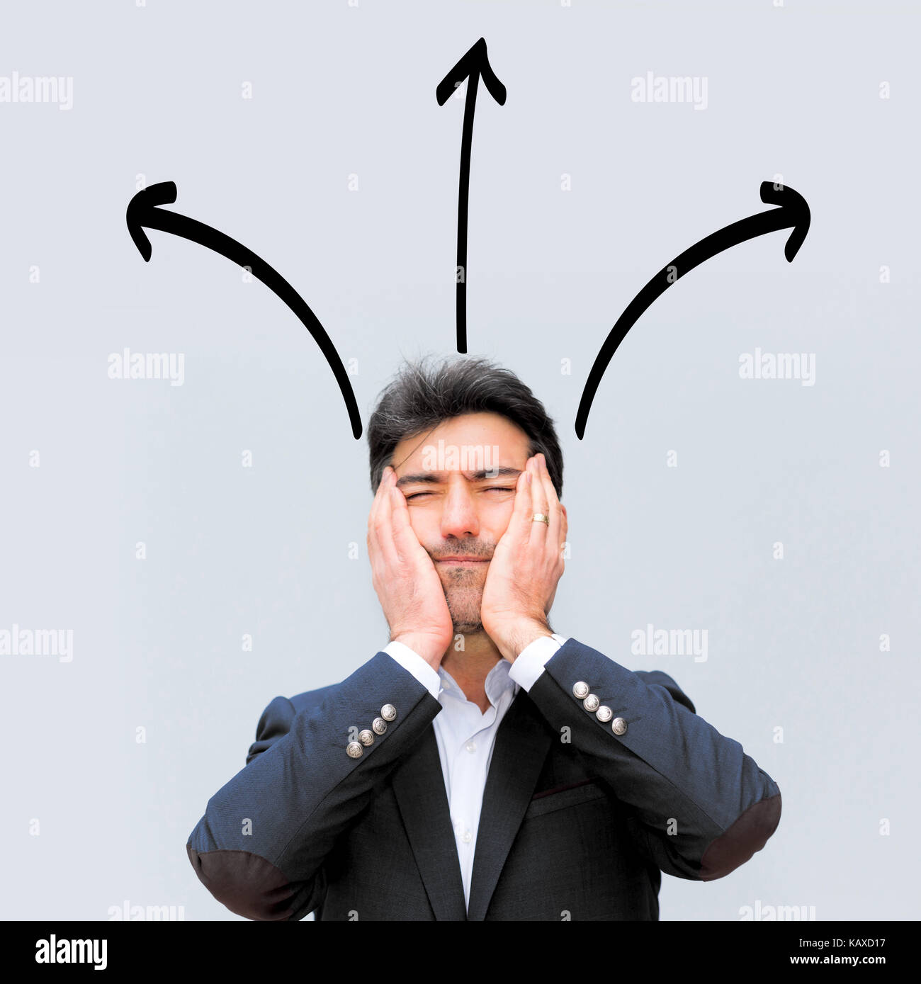 Portrait view of an attractive business man with arrows over his head ...