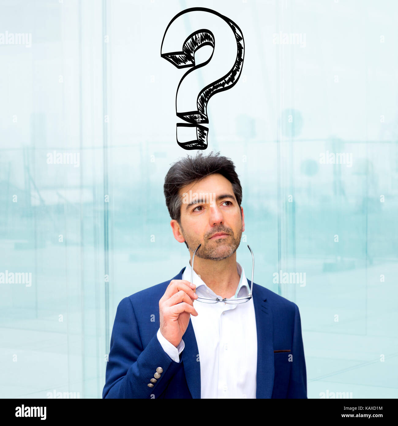 Portrait view of an attractive stressed business man with question mark ...