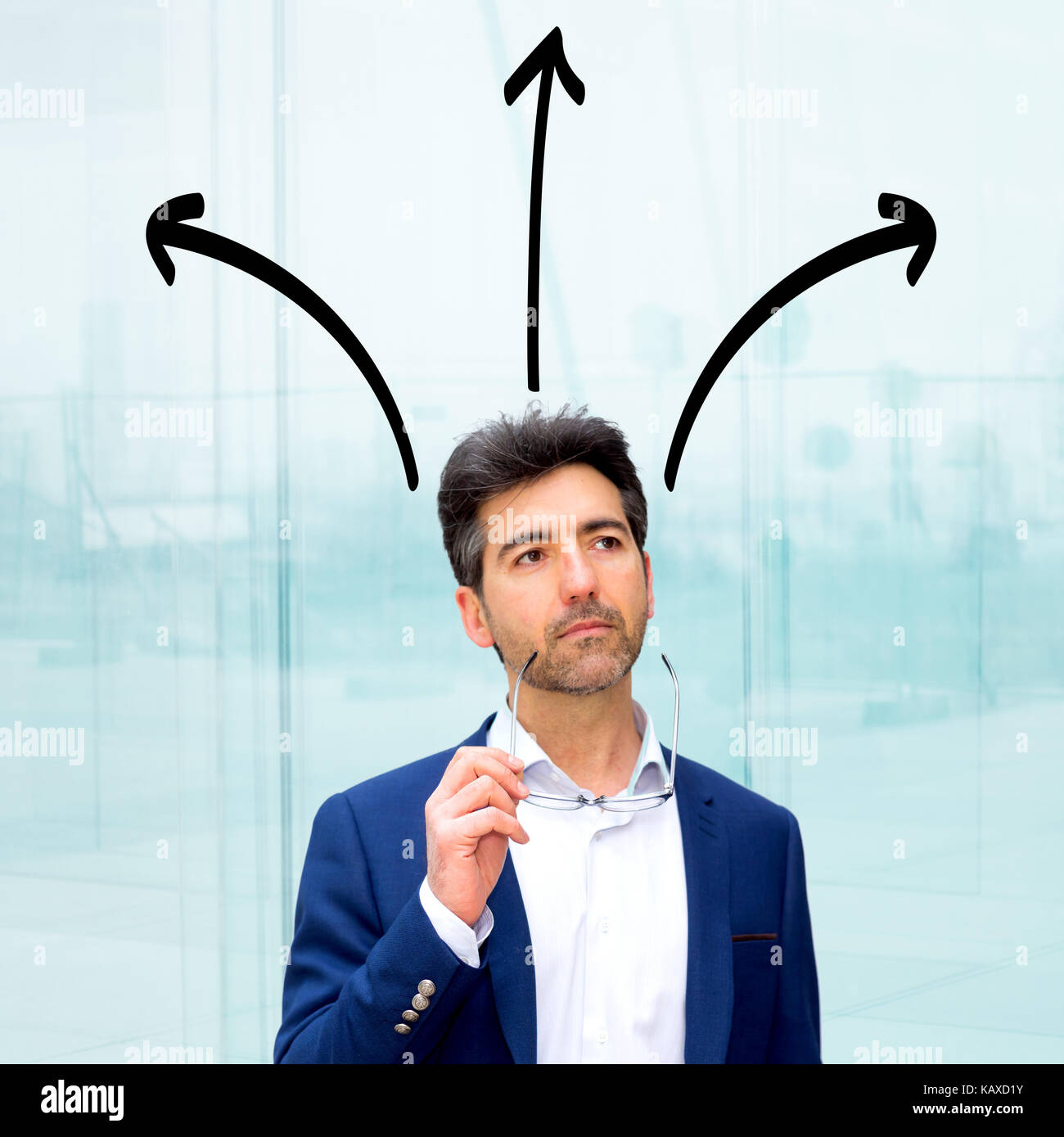 Portrait view of an attractive business man with arrows over his head ...