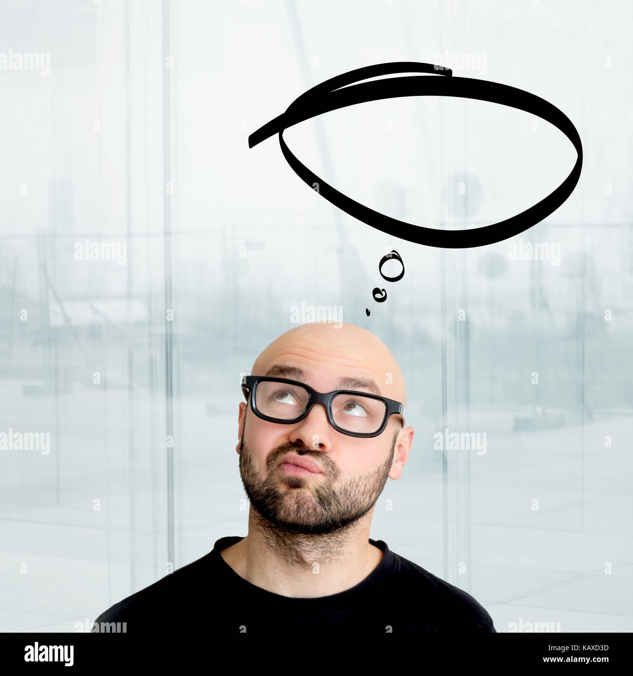 Portrait view of an attractive dubious geek man with thinking comics ...