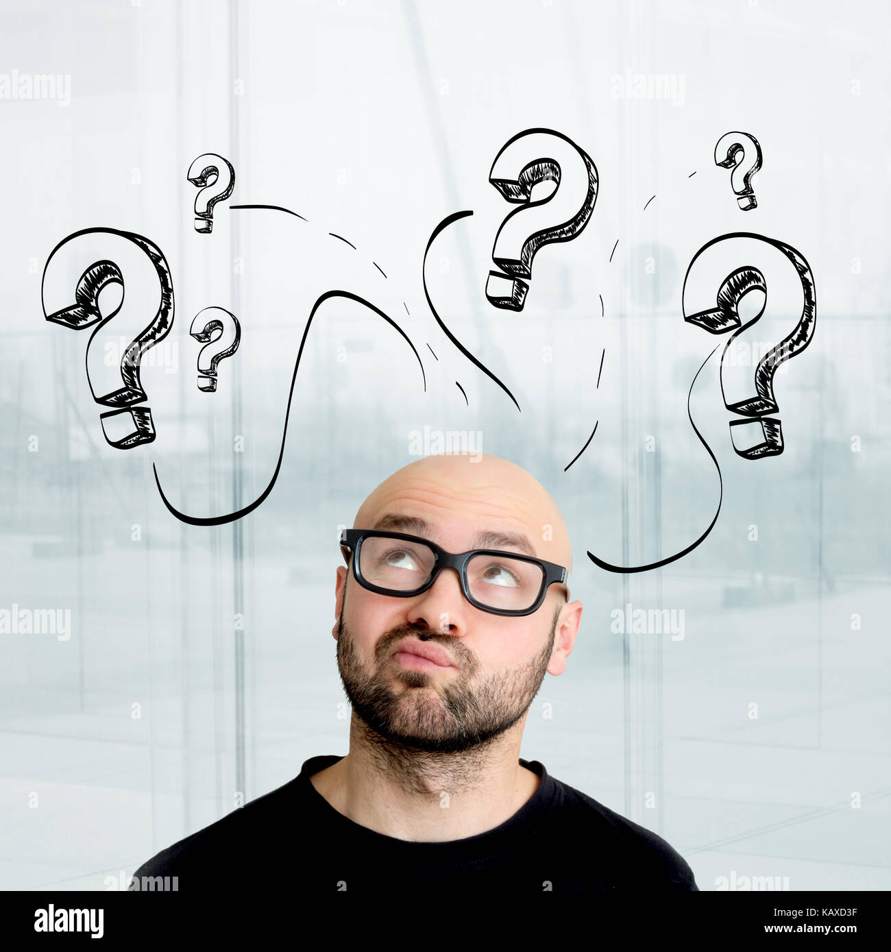 Portrait view of an attractive stressed geek man with question mark ...