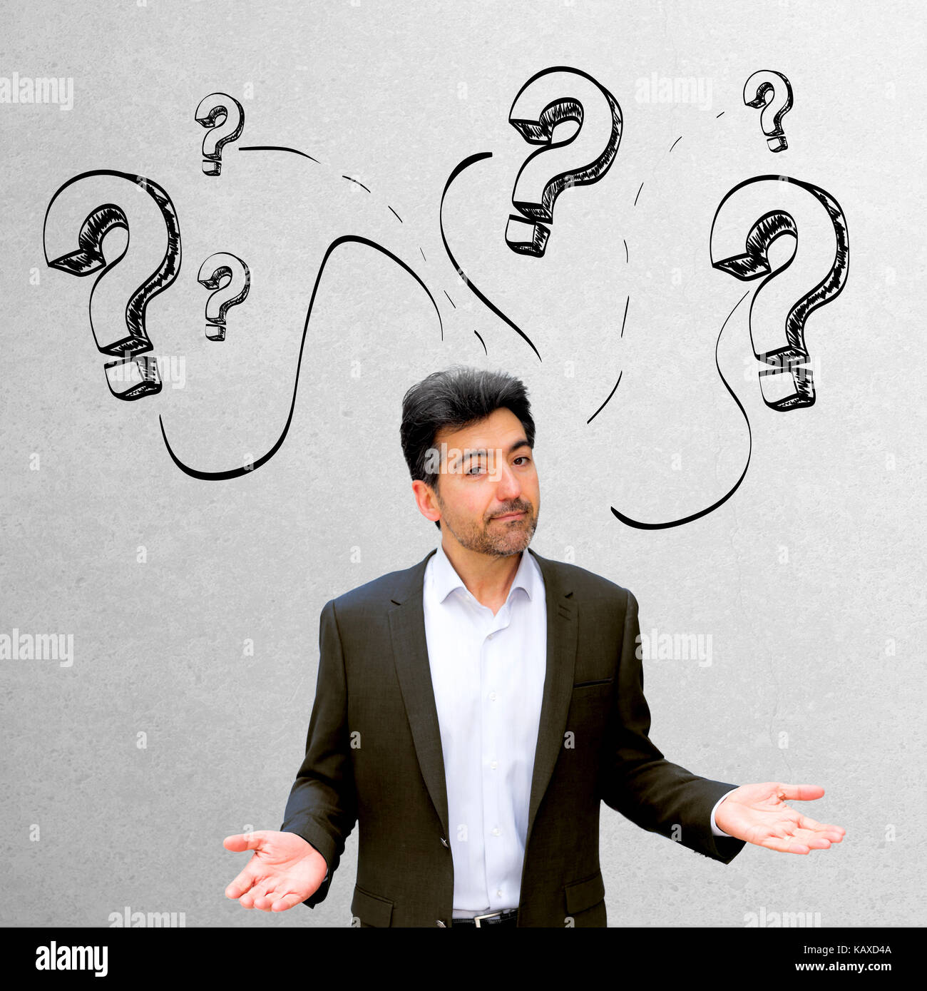 Portrait view of an attractive stressed business man with question mark ...