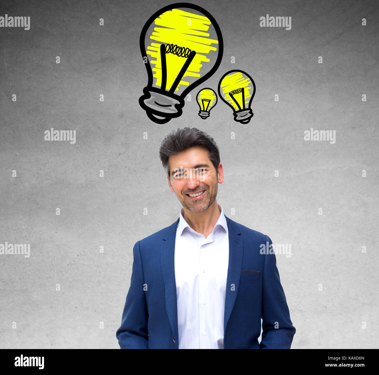 Portrait view of an attractive business man with bulb lamp inspiration ...