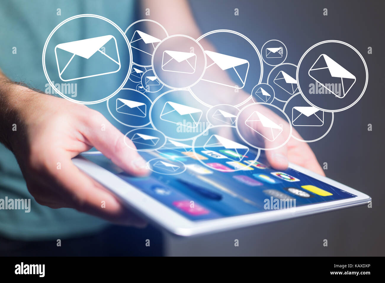 Concept view of sending email on tablet interface with message icon ...