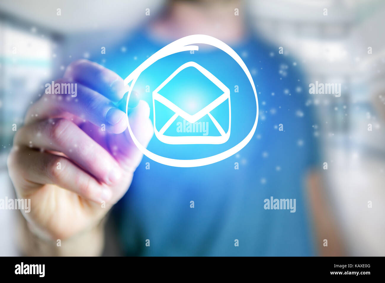 View of a Man drawing an email icon on a futuristic interface ...