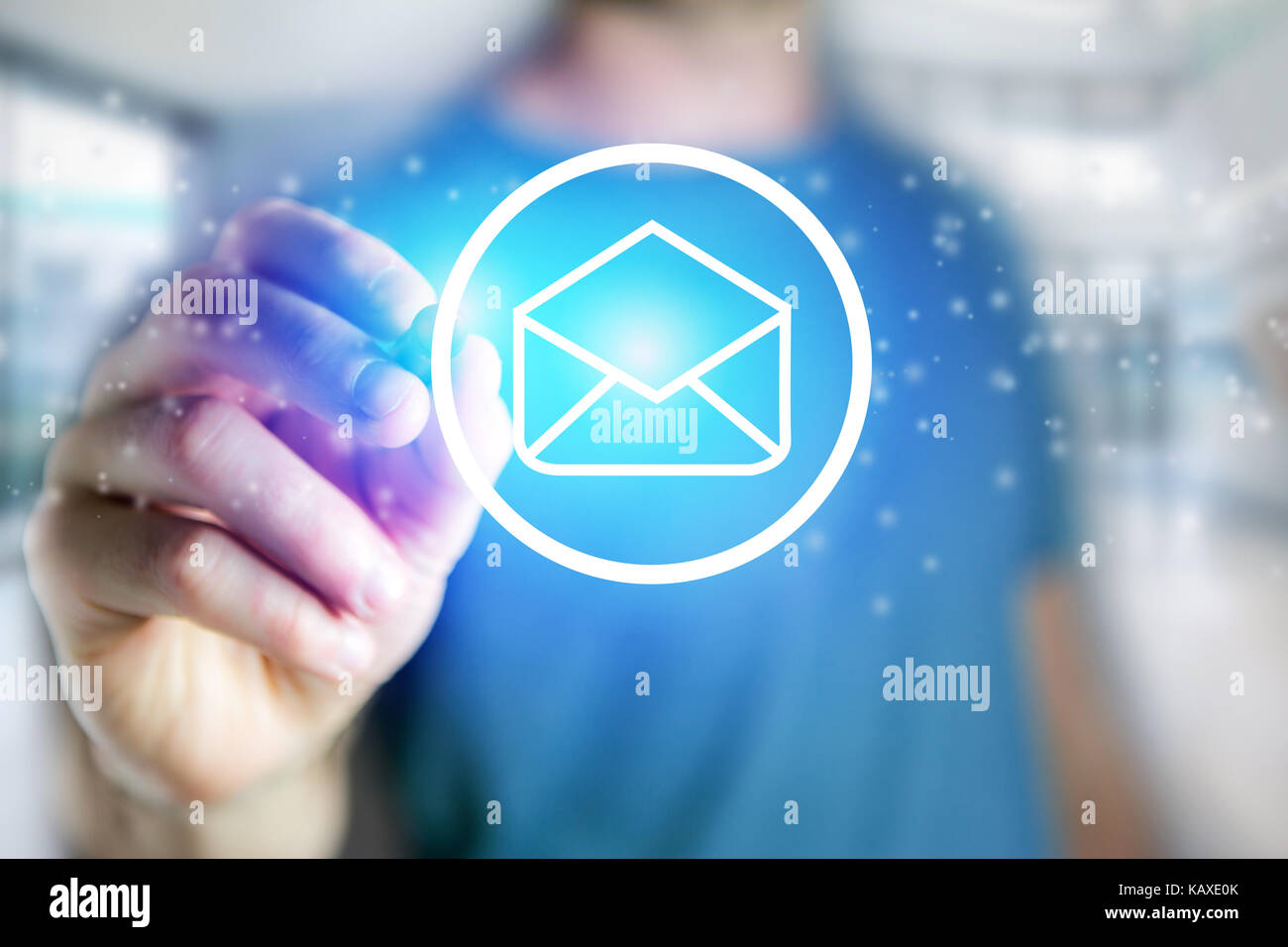 View of a Man drawing an email icon on a futuristic interface ...