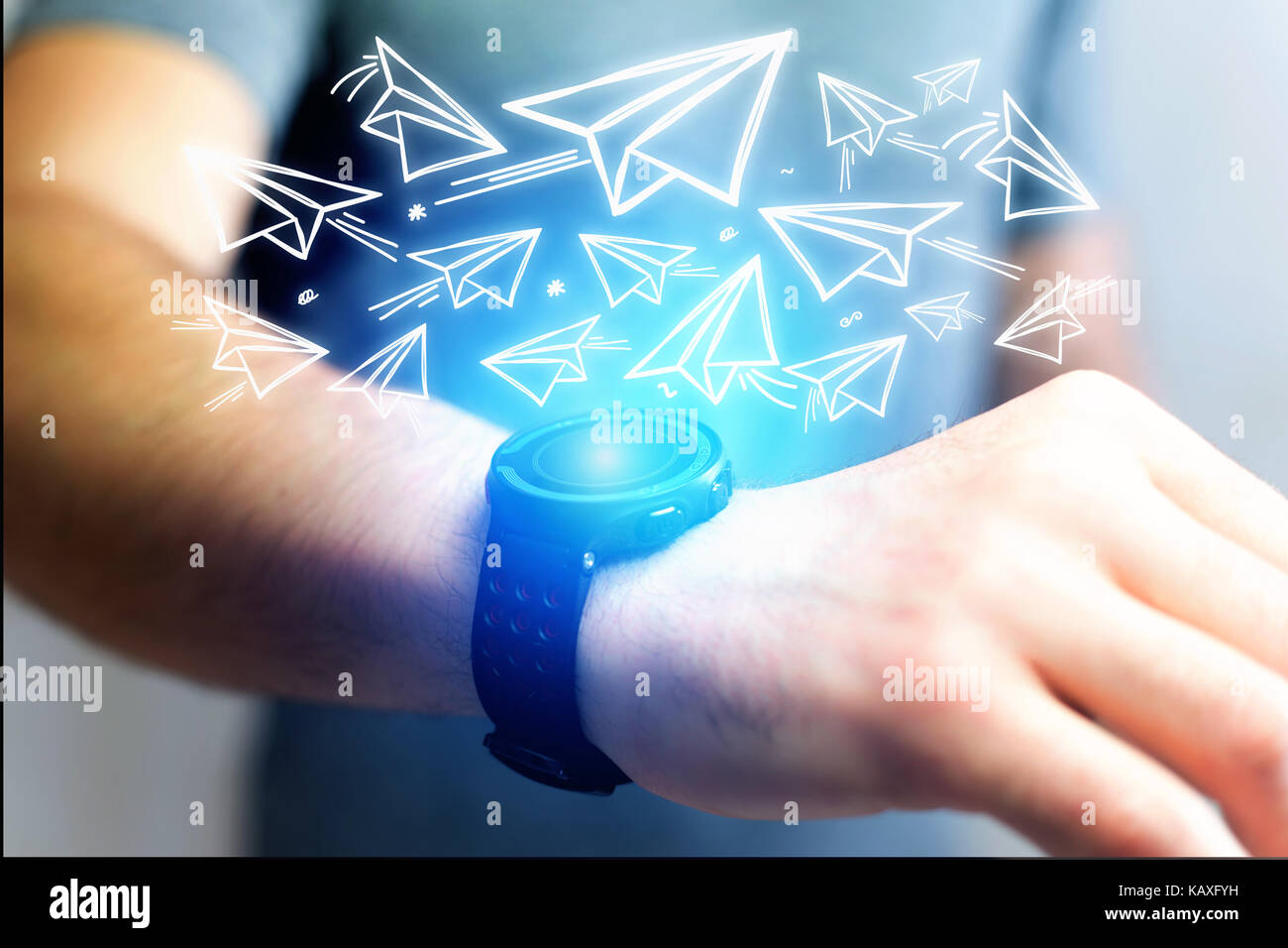 Concept view of creativity with flying paper plane over a smartwatch ...