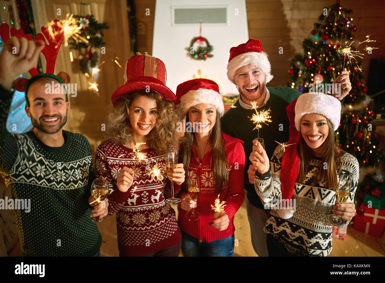 Group of cheerful friends celebrating New Year together Stock Photo - Alamy