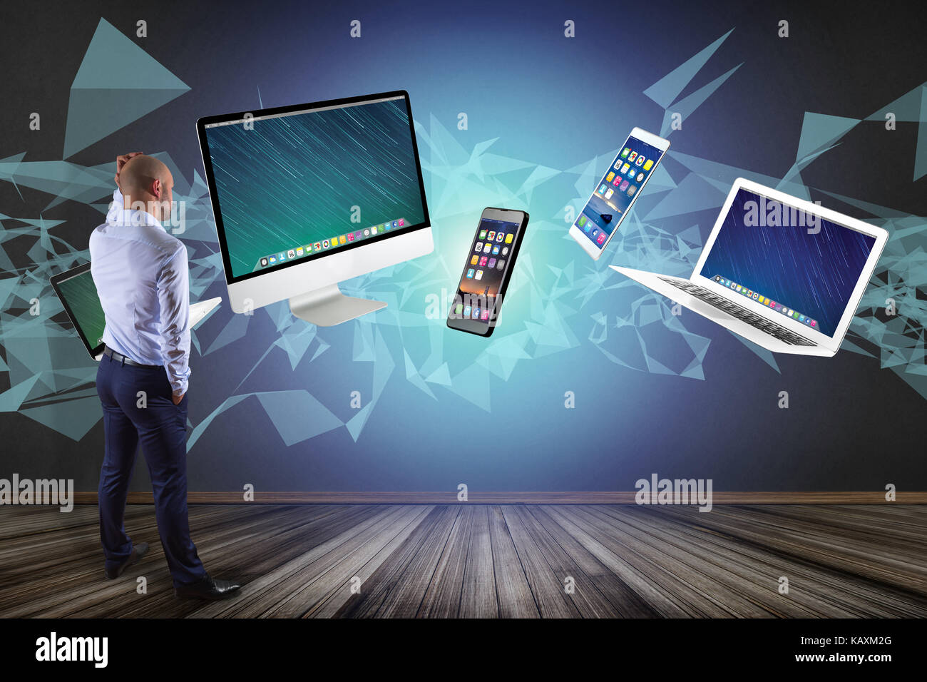 View of a Businessman in front of a wall with Computer and devices ...