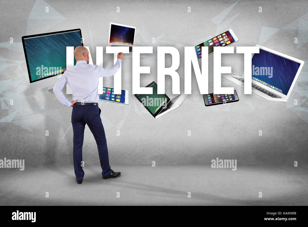 View of a Businessman in front of a wall with Internet title surounded ...