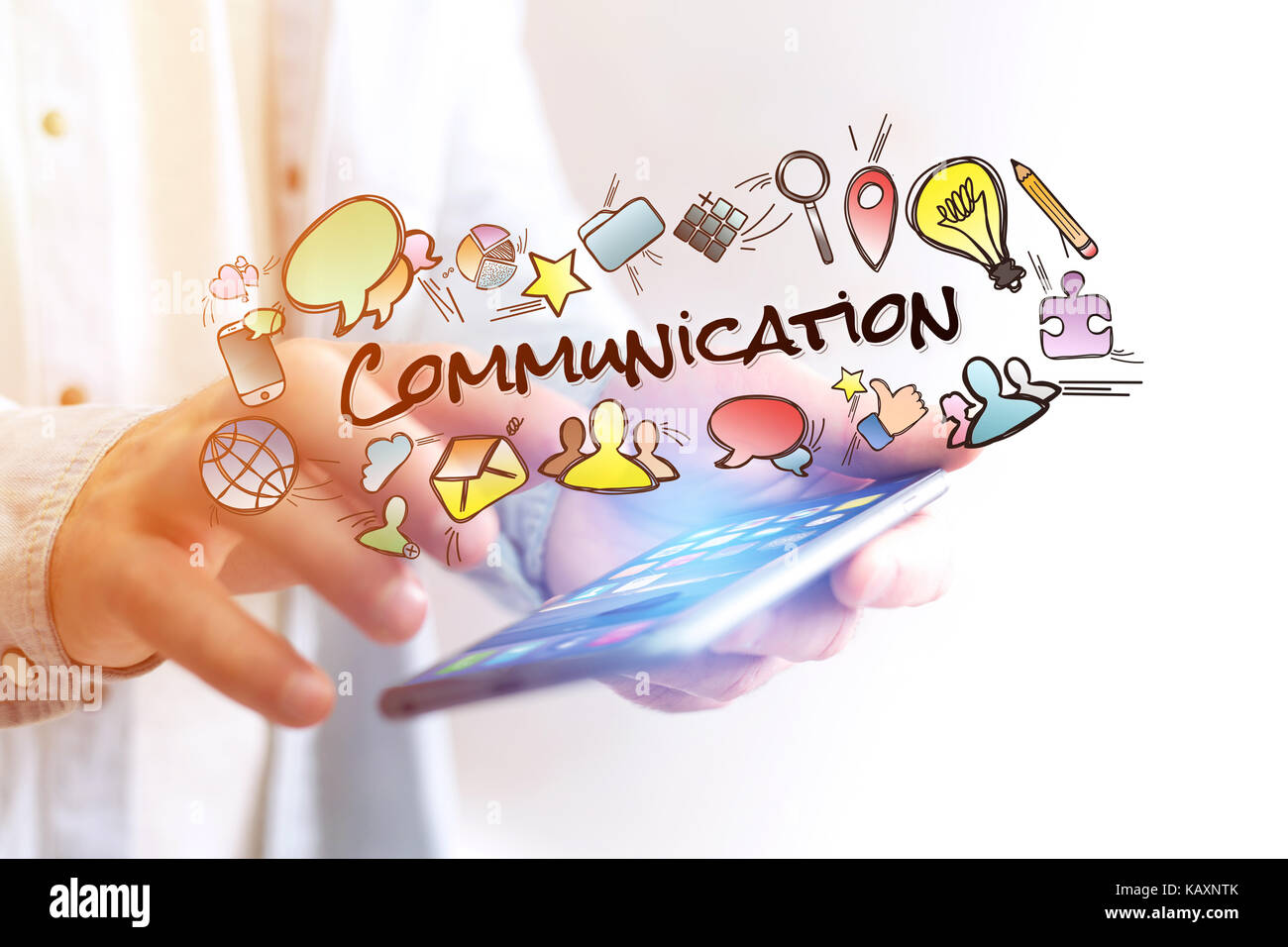 Concept view of man holding smartphone with communication title and ...