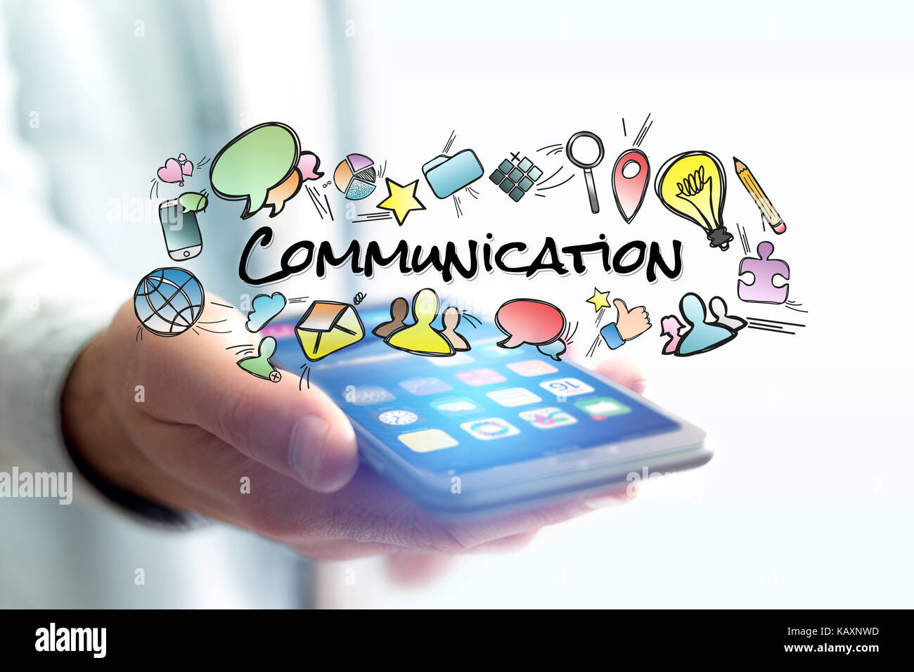 Concept view of man holding smartphone with communication title and ...
