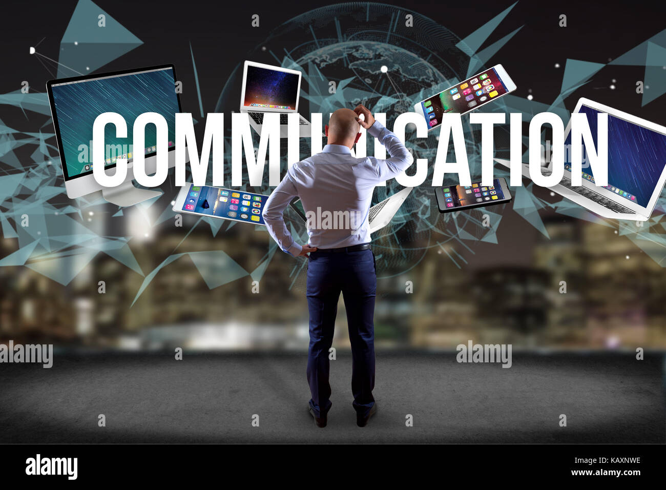View of a Businessman in front of a wall with Communication title ...