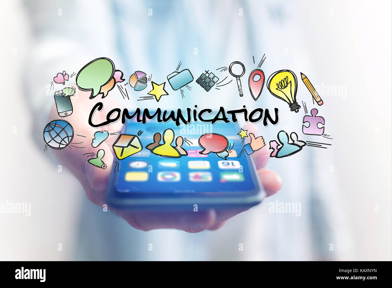 Concept view of man holding smartphone with communication title and ...