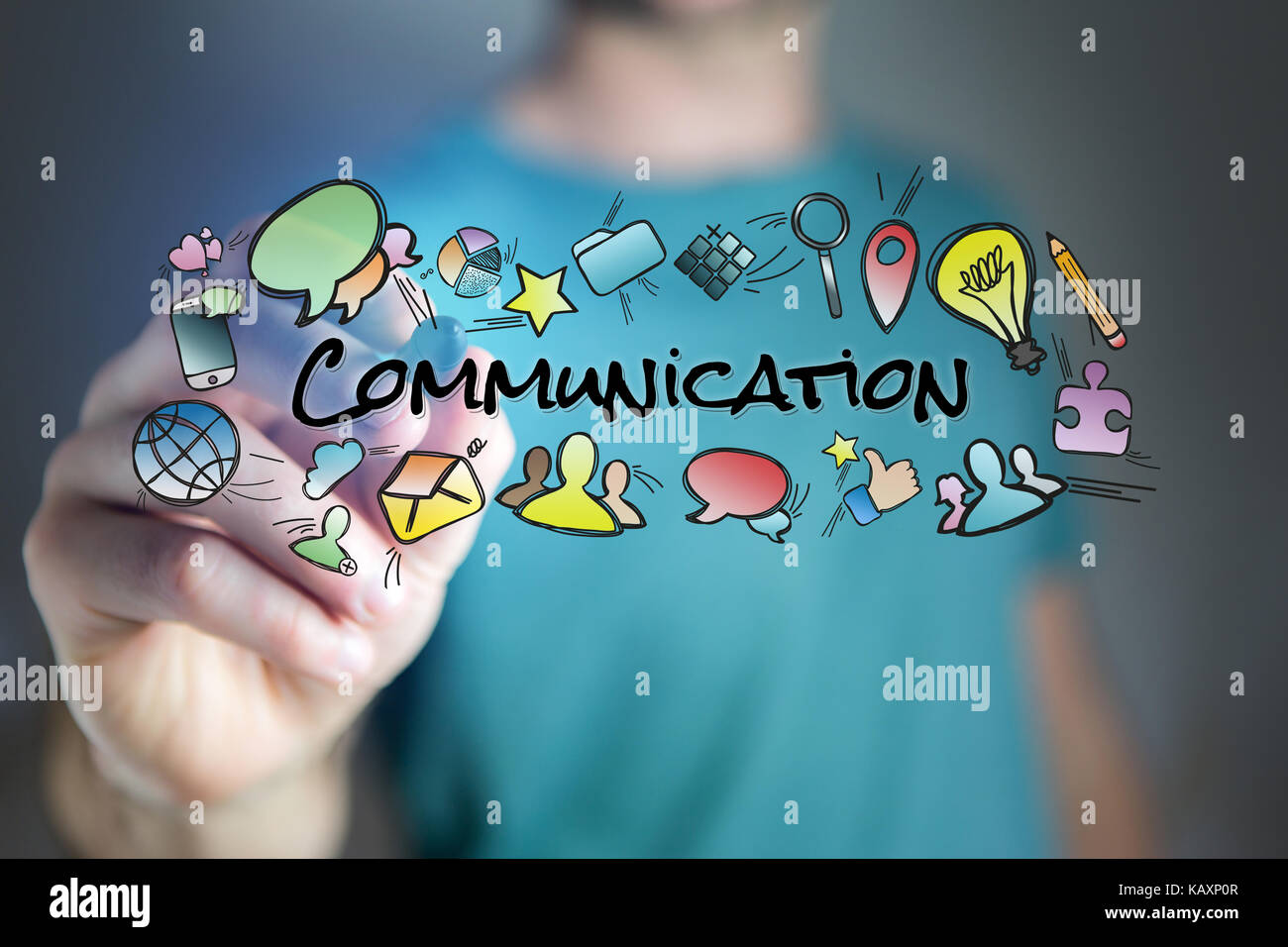 Concept view of man drawing communication title and multimedia icons ...