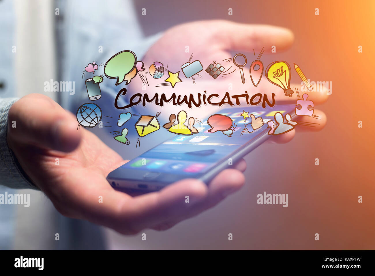 Concept view of man holding smartphone with communication title and ...