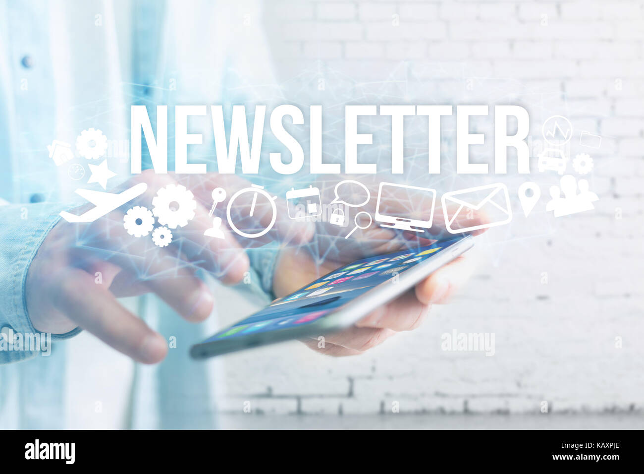 Concept view of man holding futuristic interface with newsletter title ...