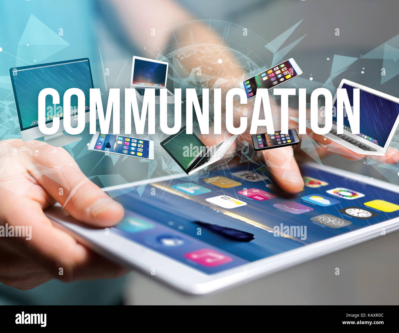 View of a Communication title surounded by device like smartphone ...